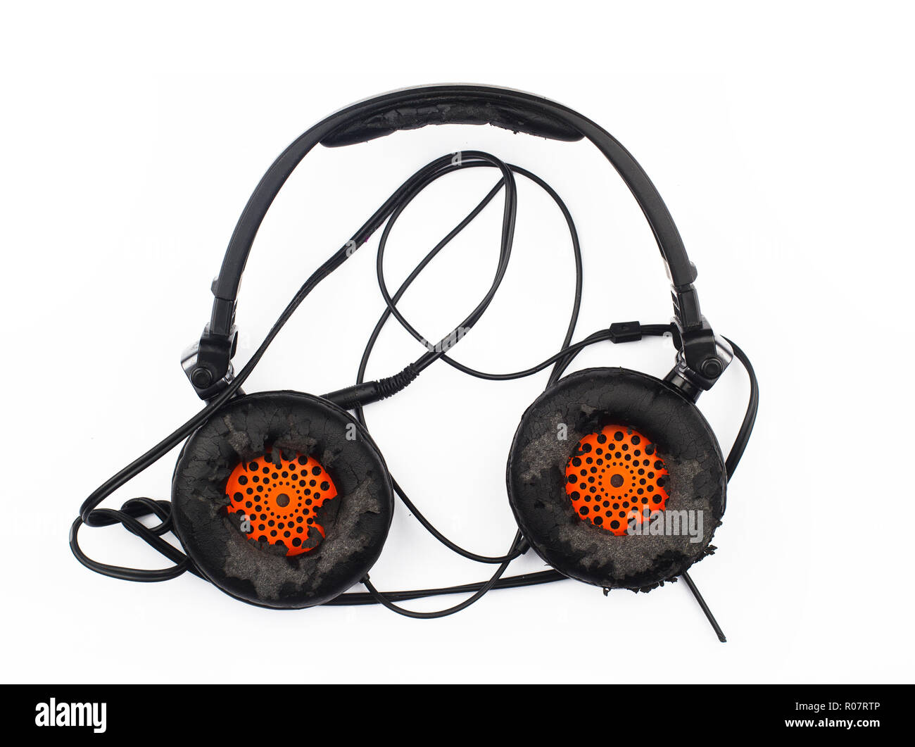 top view closeup of damaged black audio headset isolated on white ...