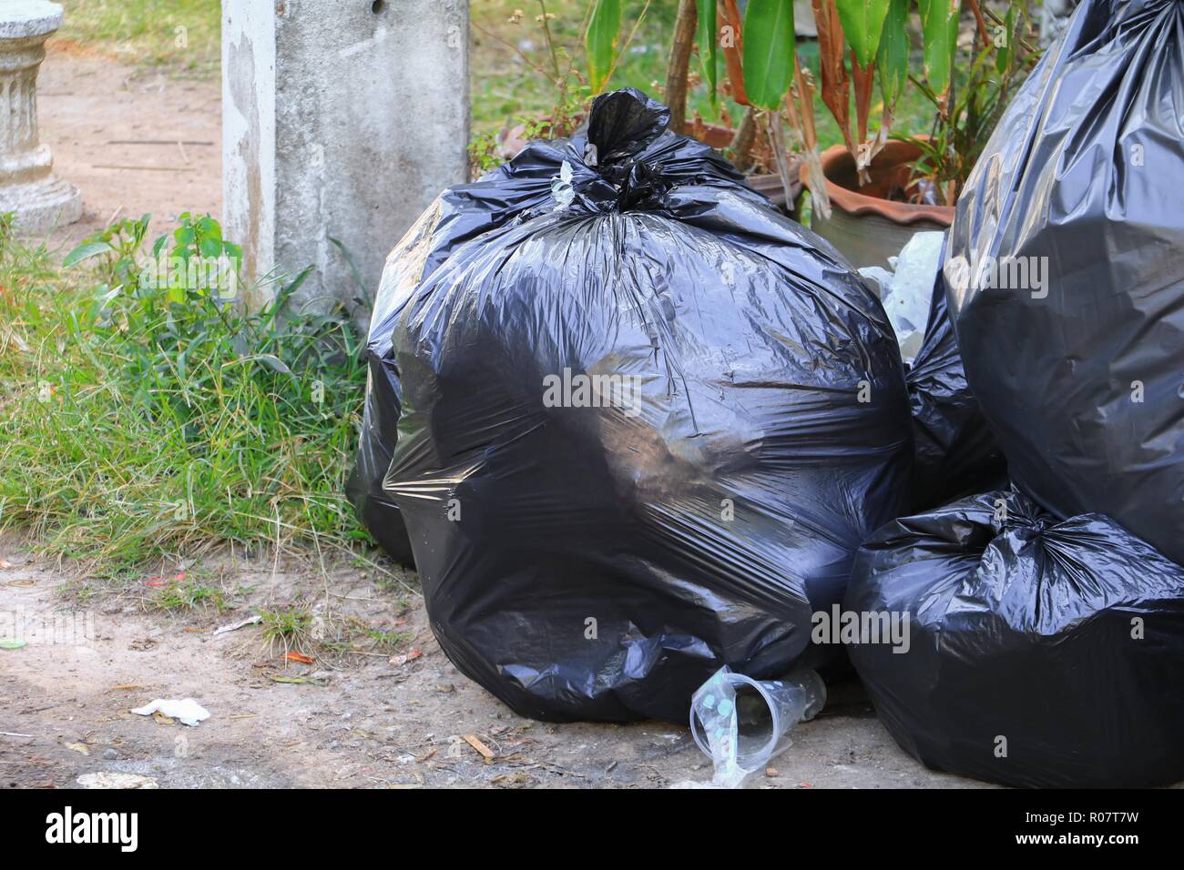 Pile black garbage bag roadside hi-res stock photography and images - Alamy