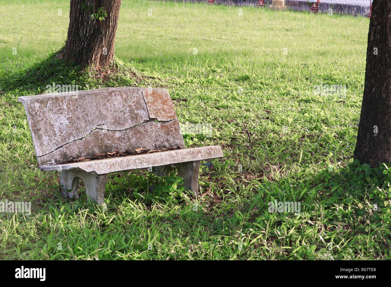 Old polished stone chair in the garden Stock Photo - Alamy