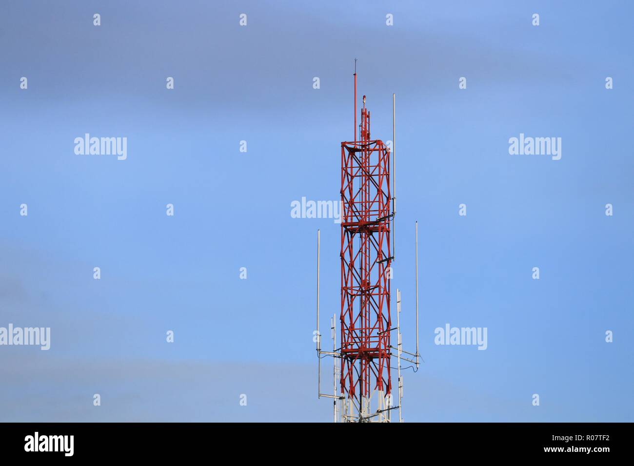 Telecommunication tower red and white antenna radio telephone mobile on ...