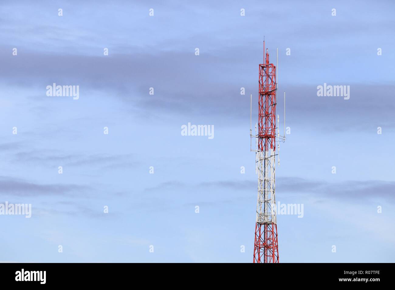 Telecommunication tower red and white antenna radio telephone mobile on ...