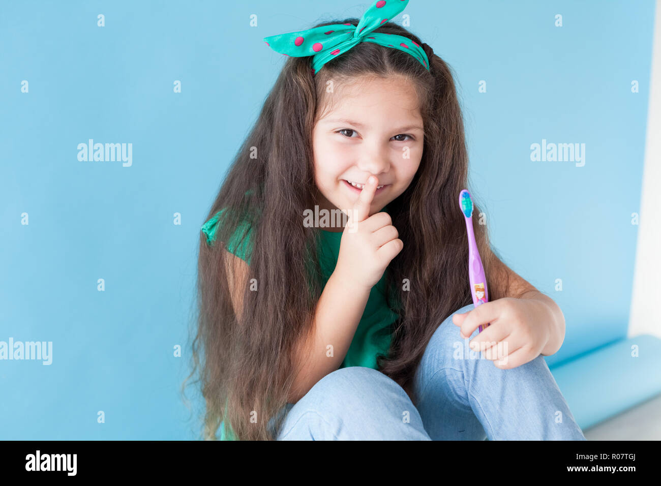 little girl with no teeth with a toothbrush in dentistry Stock Photo ...