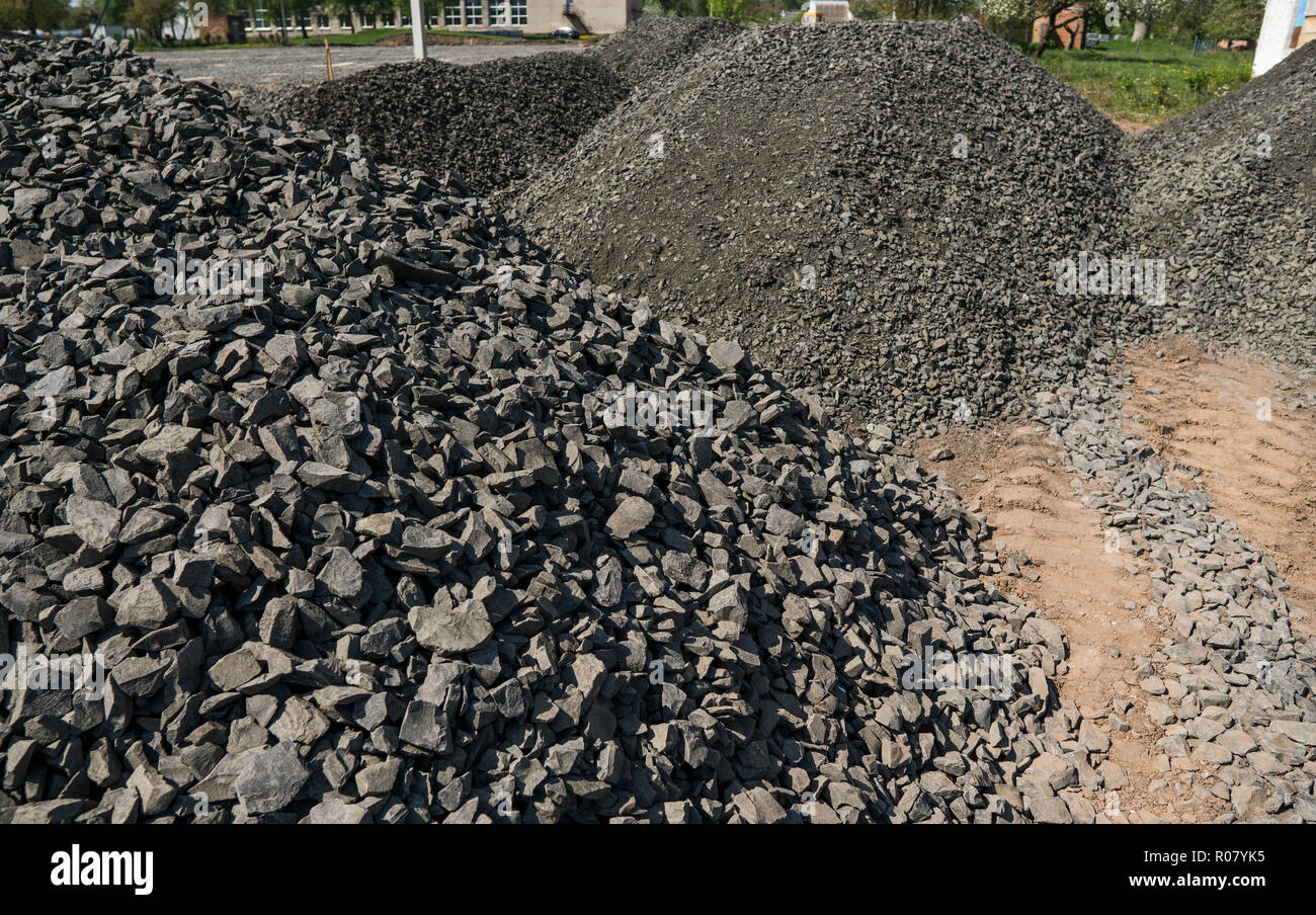 Black road stones gravel. Rocks for construction. Crushed granite ...
