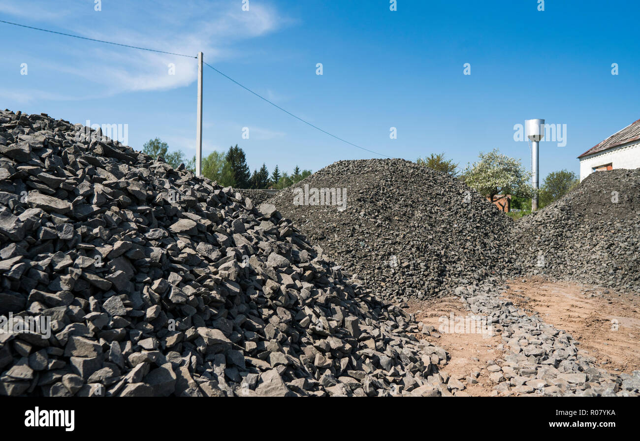 Black road stones gravel. Rocks for construction. Crushed granite ...