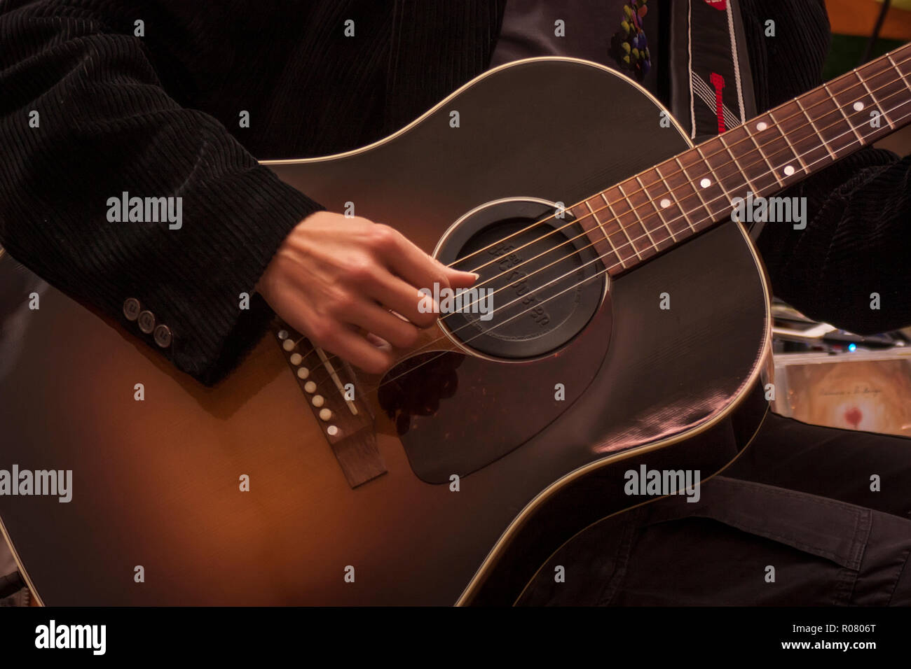 Image of a traditional guitar while being played by a musician Stock ...