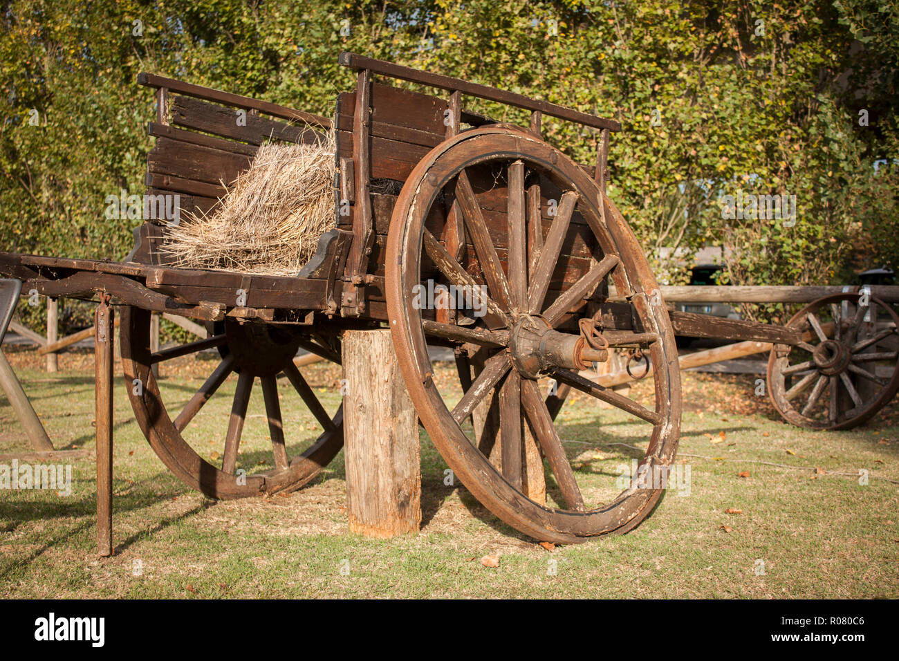 Old and worn vintage wooden carriage used as a decor element inside a ...