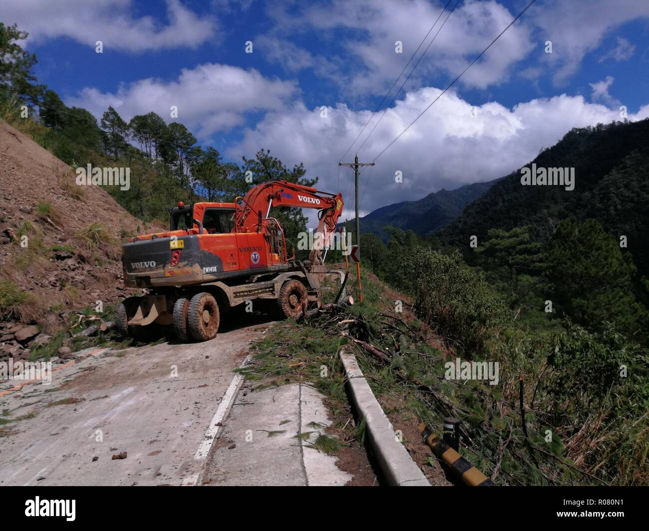 Clearing the landslide going to Natonin town in the Mountain Province ...