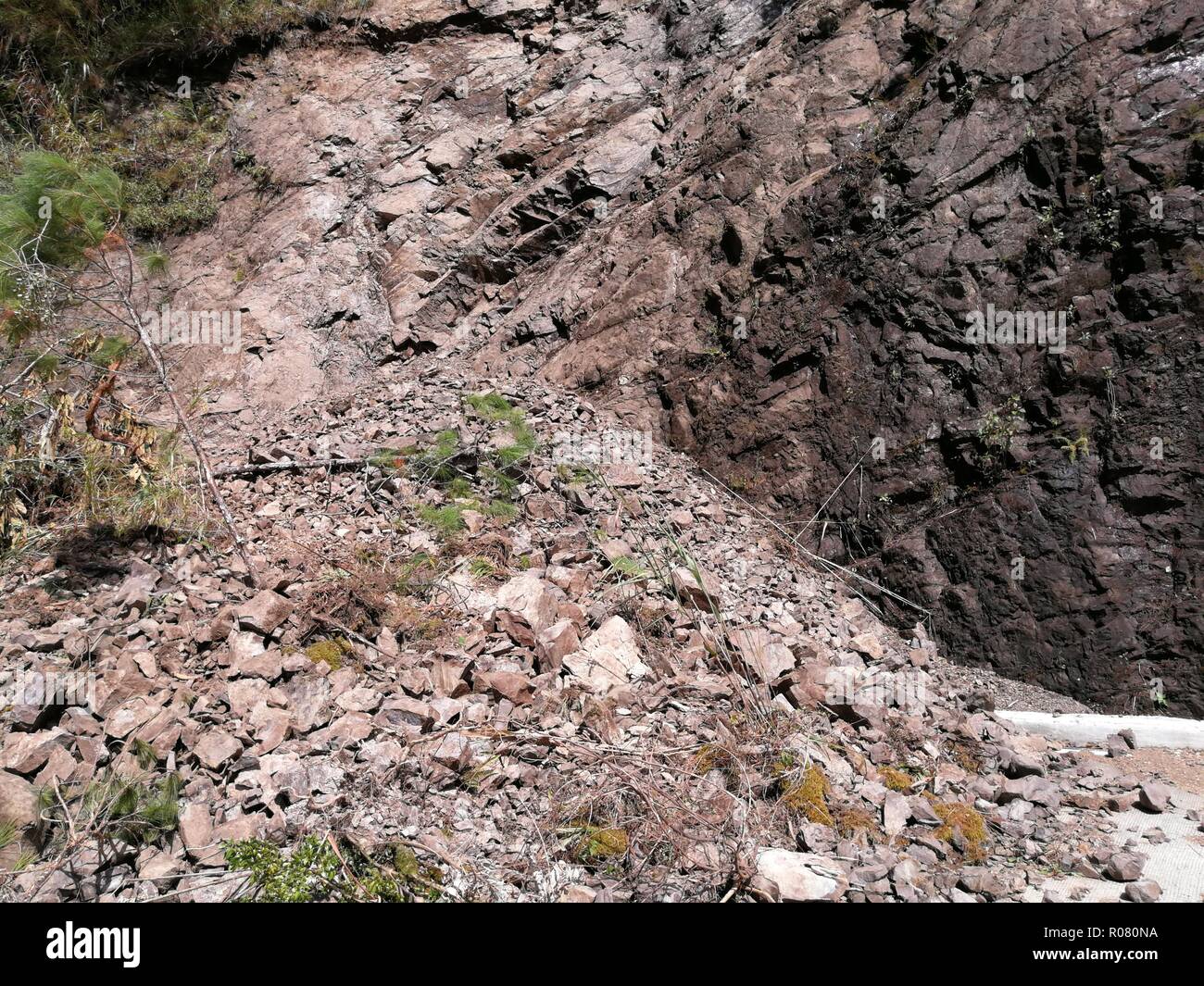 Clearing the landslide going to Natonin town in the Mountain Province ...