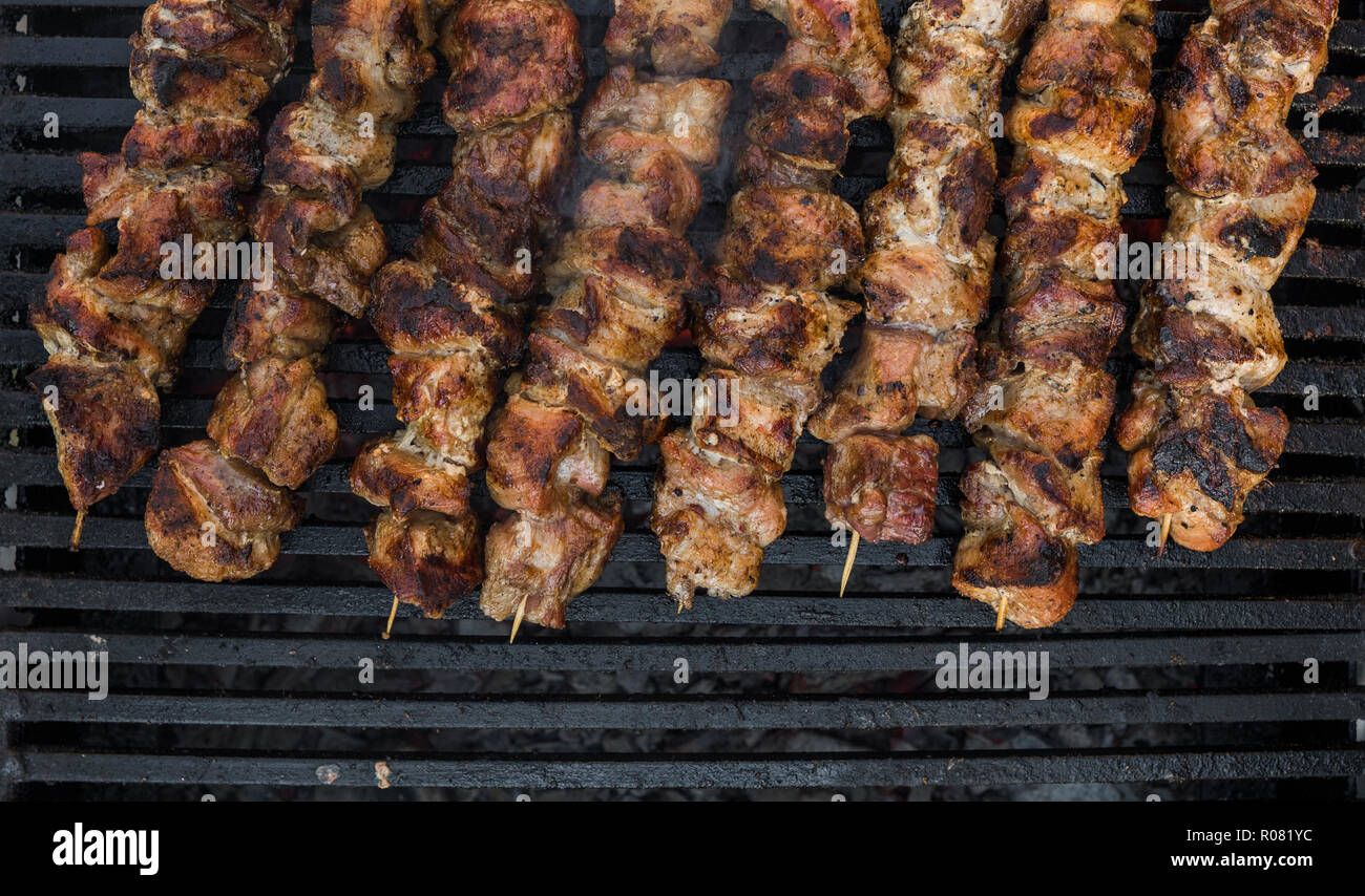Assorted delicious grilled meat over the coals on barbecue Stock Photo ...