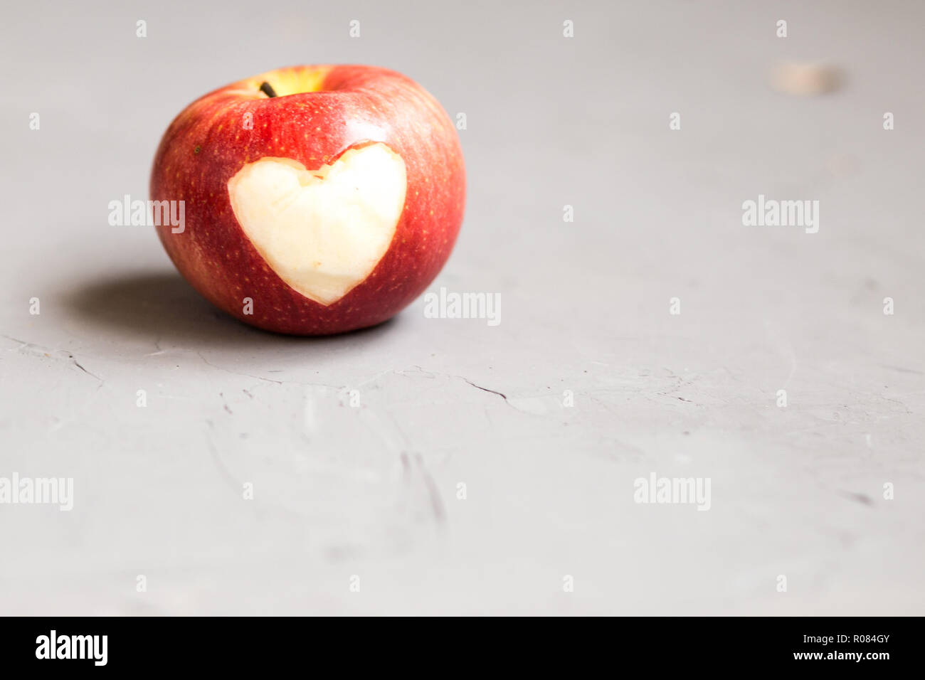 Red Apple with engraved heart Stock Photo - Alamy