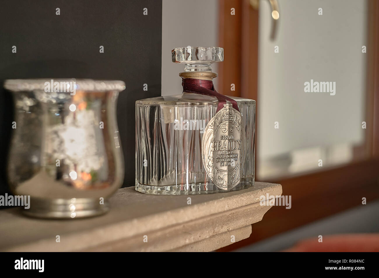 Glass bottle of empty liquor used as a decorative element in a luxury ...