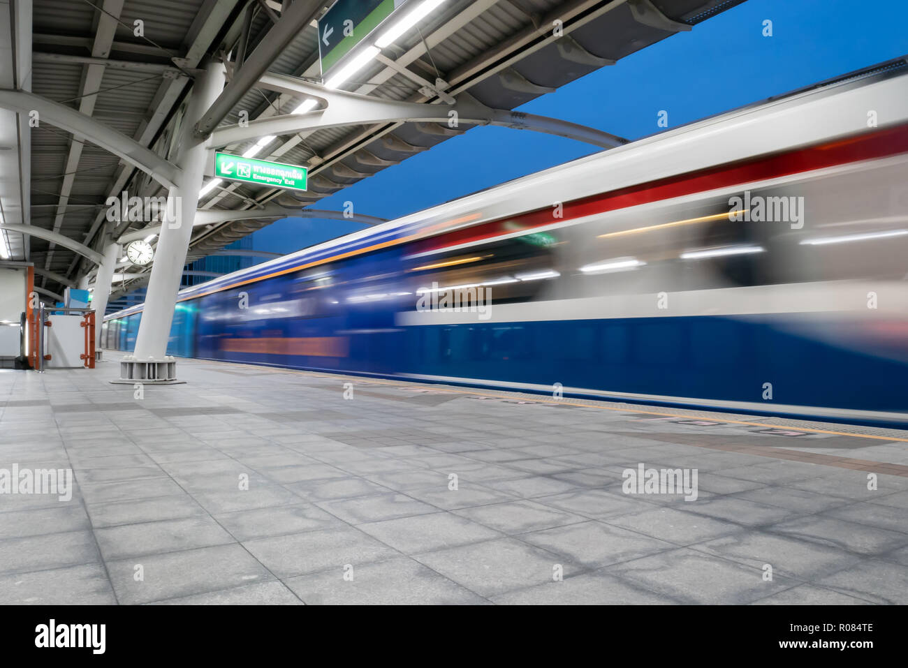 Motion blurred train arriving at the platform Stock Photo - Alamy