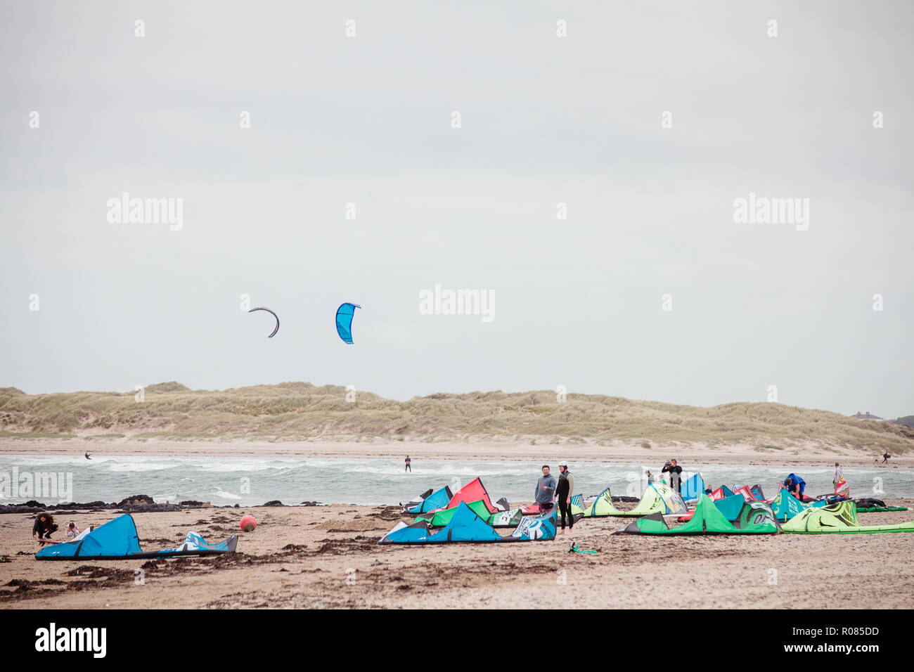 Lots of colourful kites on the beach, kite surfing, Rhosneigr, Anglesey ...