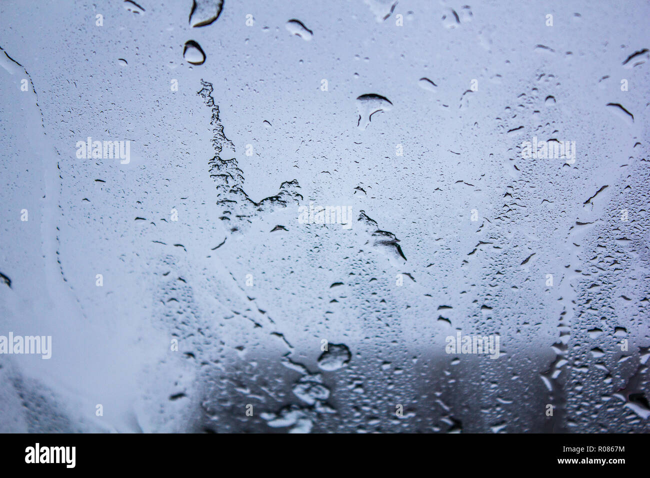 Drops of water on the glass. Background of water drops flowing down the ...