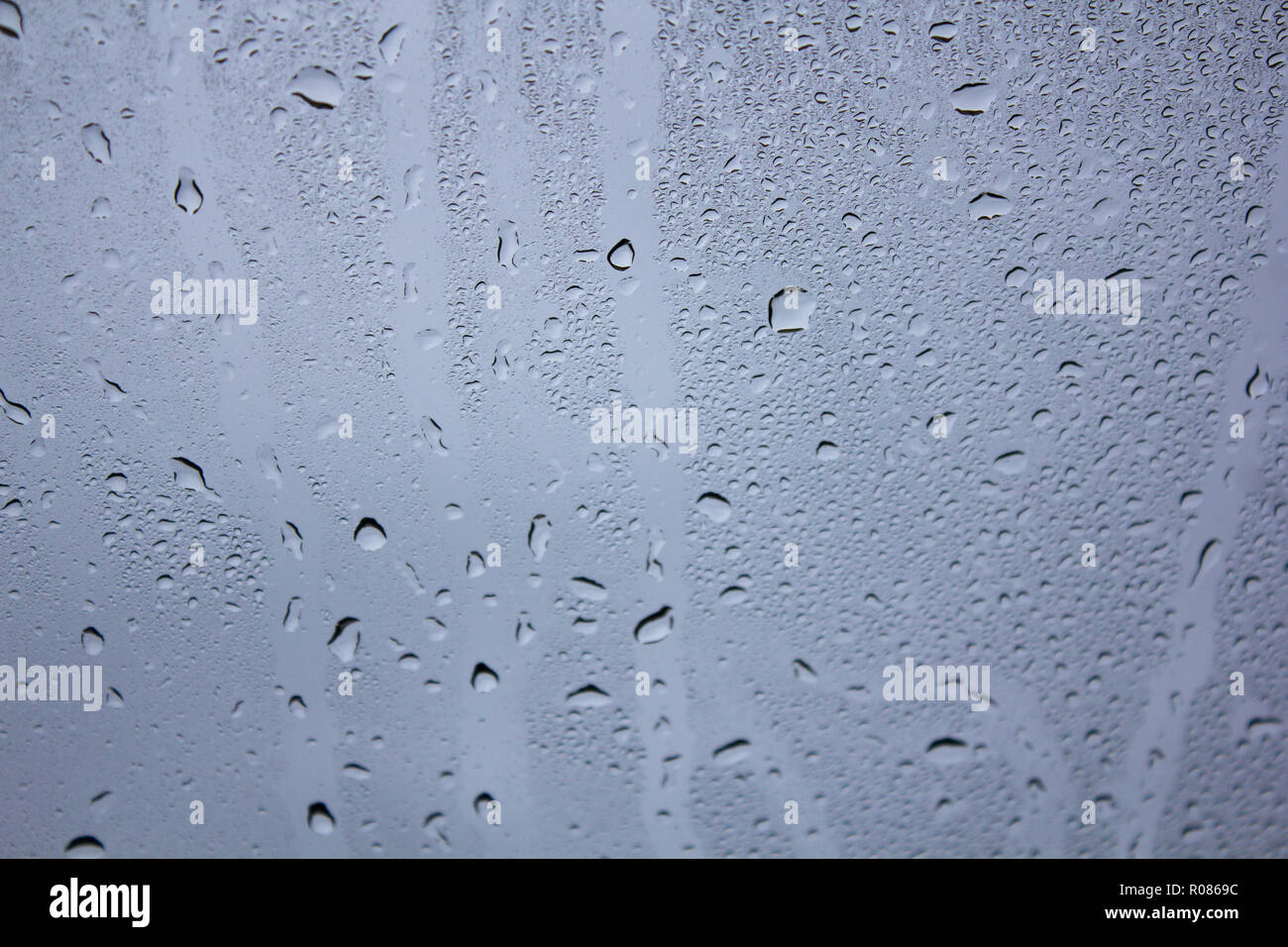 Drops of water on the glass. Background of water drops flowing down the ...