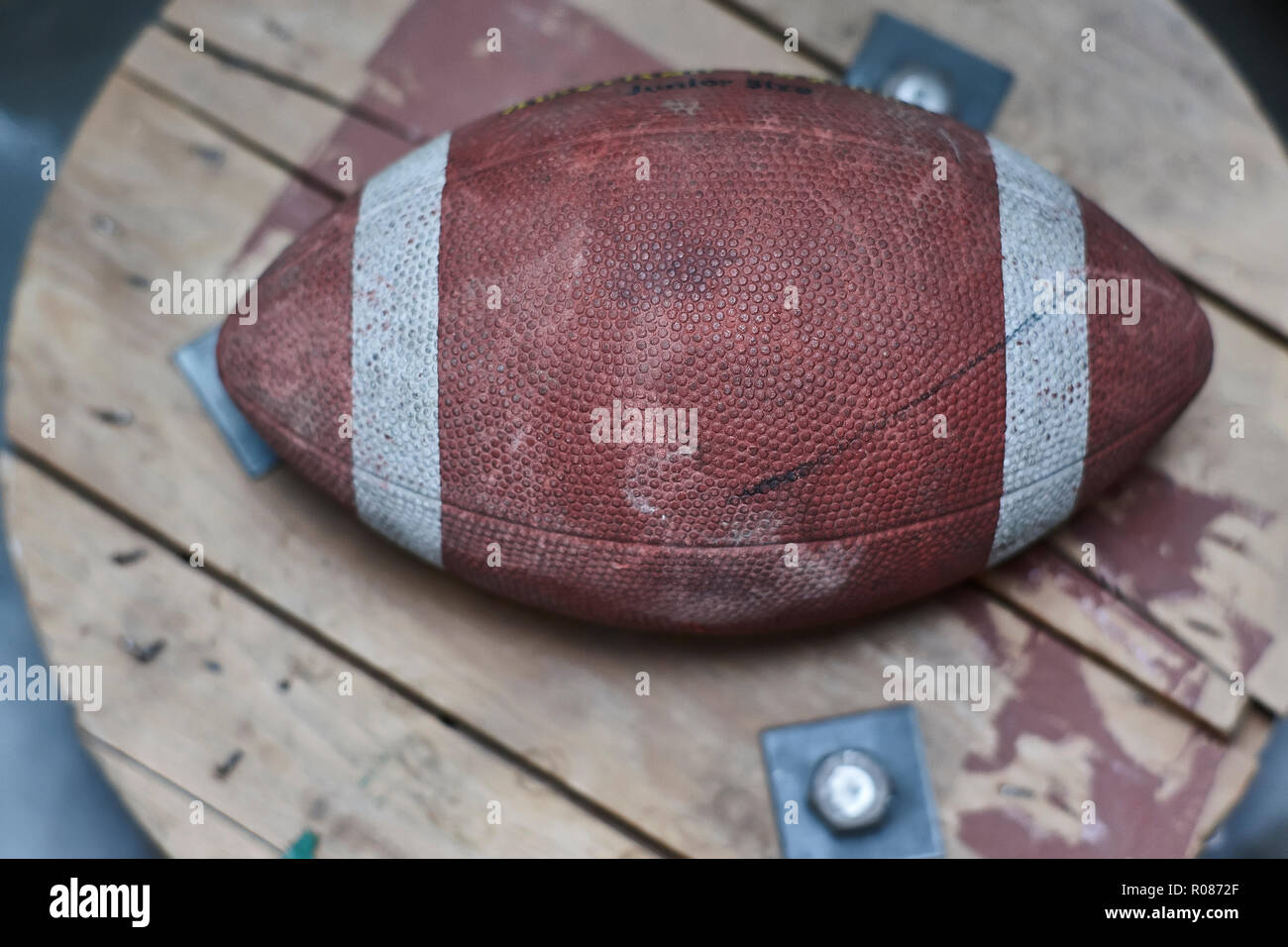 Detail of a vintage football ball with all the signs of time and wear ...