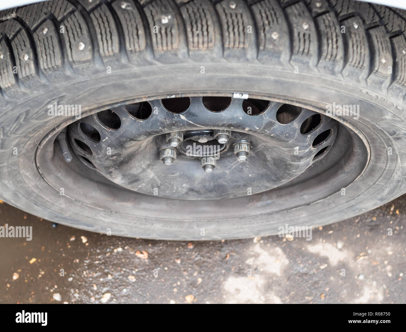 top view of attached used studded winter tire on car during for ...