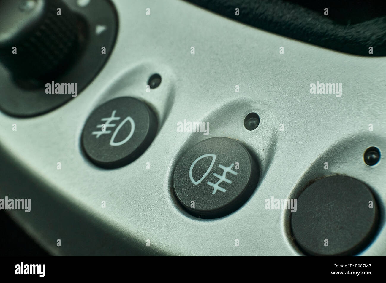 Buttons with warning lights of the fog lamps and headlights of a modern ...