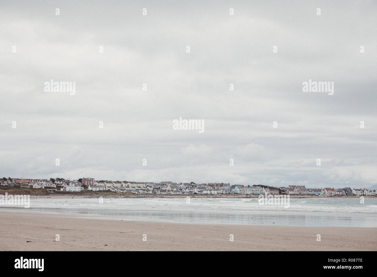 Looking across Cymyran beach towards Rhosneigr town, Anglesey, North ...