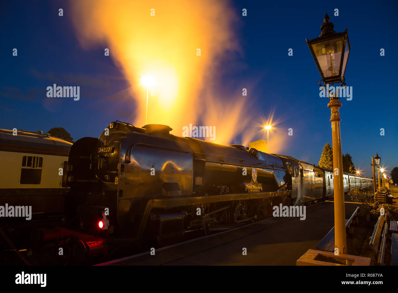 Long exposure, night shot of vintage UK steam locomotive, back-lit ...