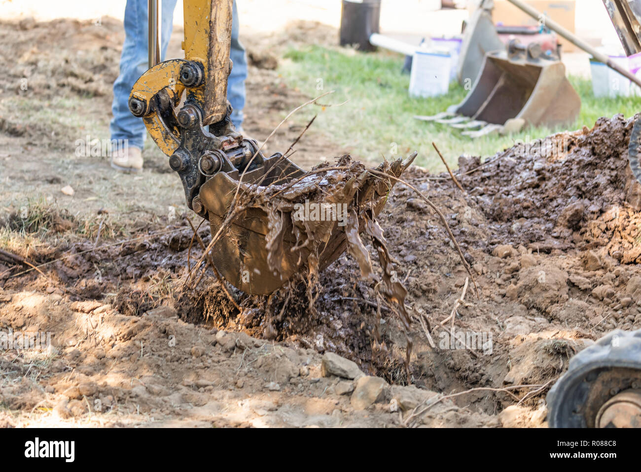 Working Excavator Tractor Digging A Trench At Construction Site Stock ...