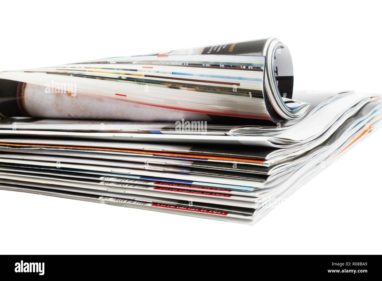 Various stacked and rolled magazines Stock Photo - Alamy