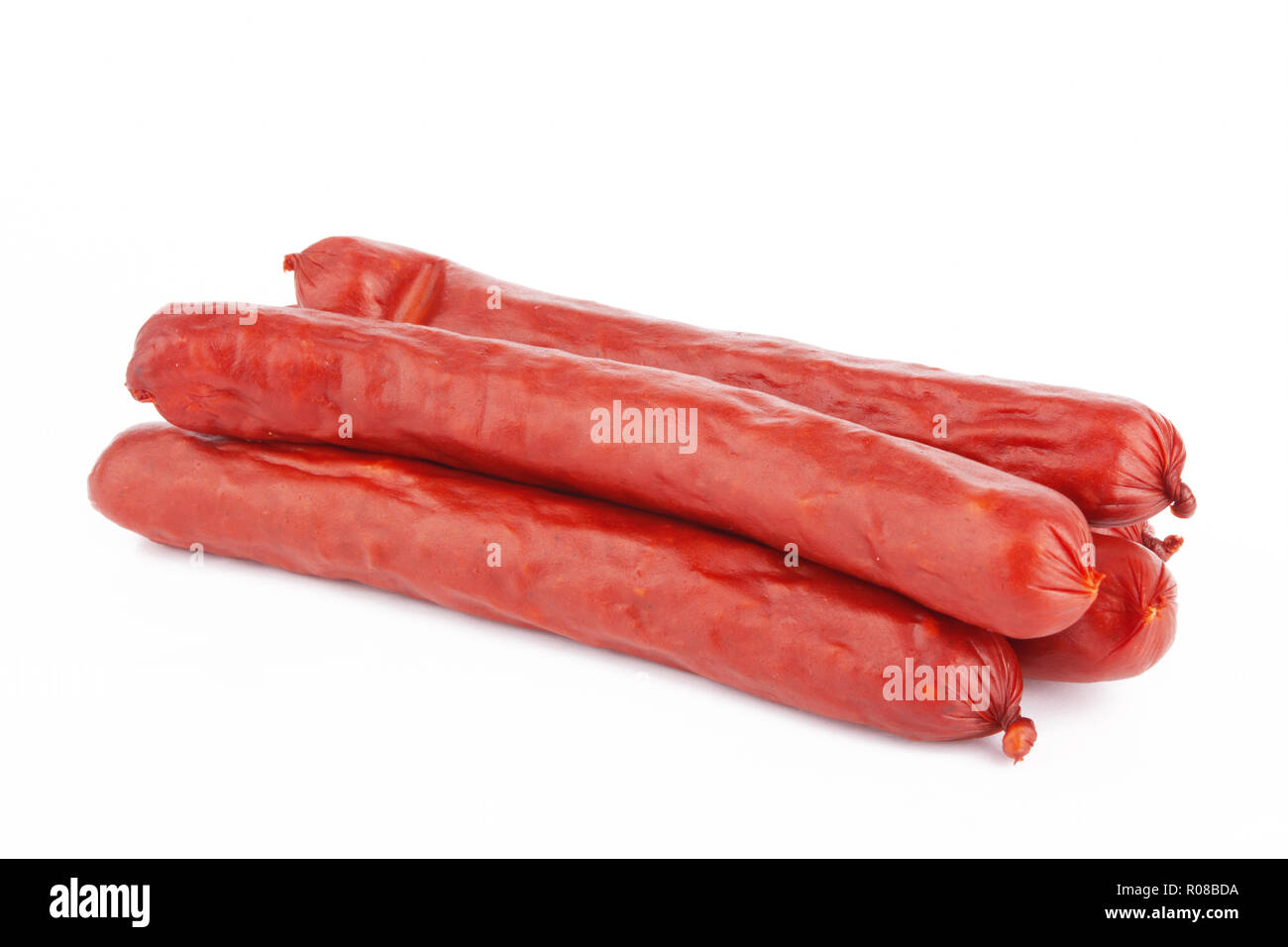 Raw red sausage on a white background Stock Photo - Alamy
