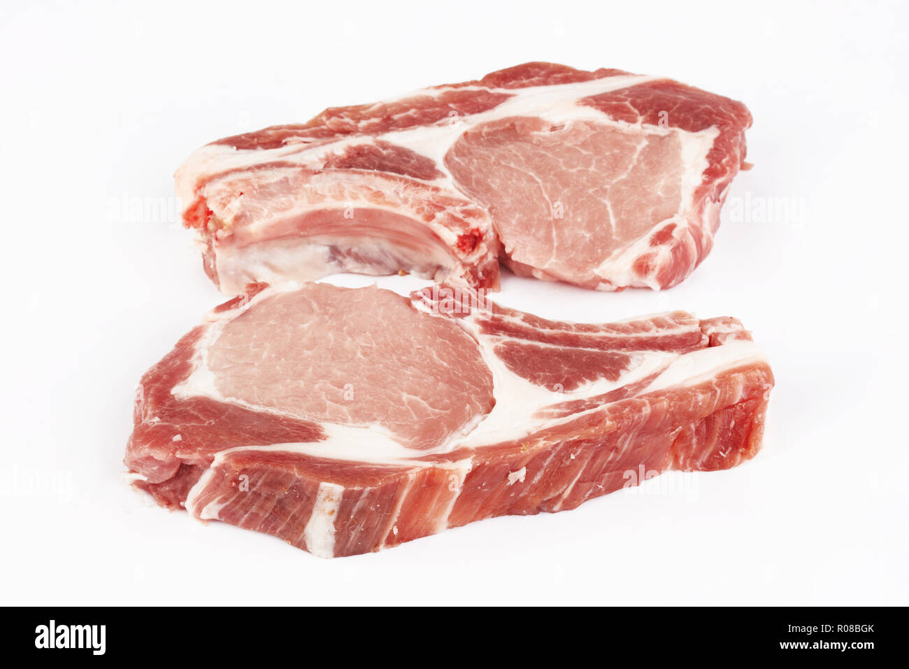 meat raw pork cutlet on a white background Stock Photo - Alamy