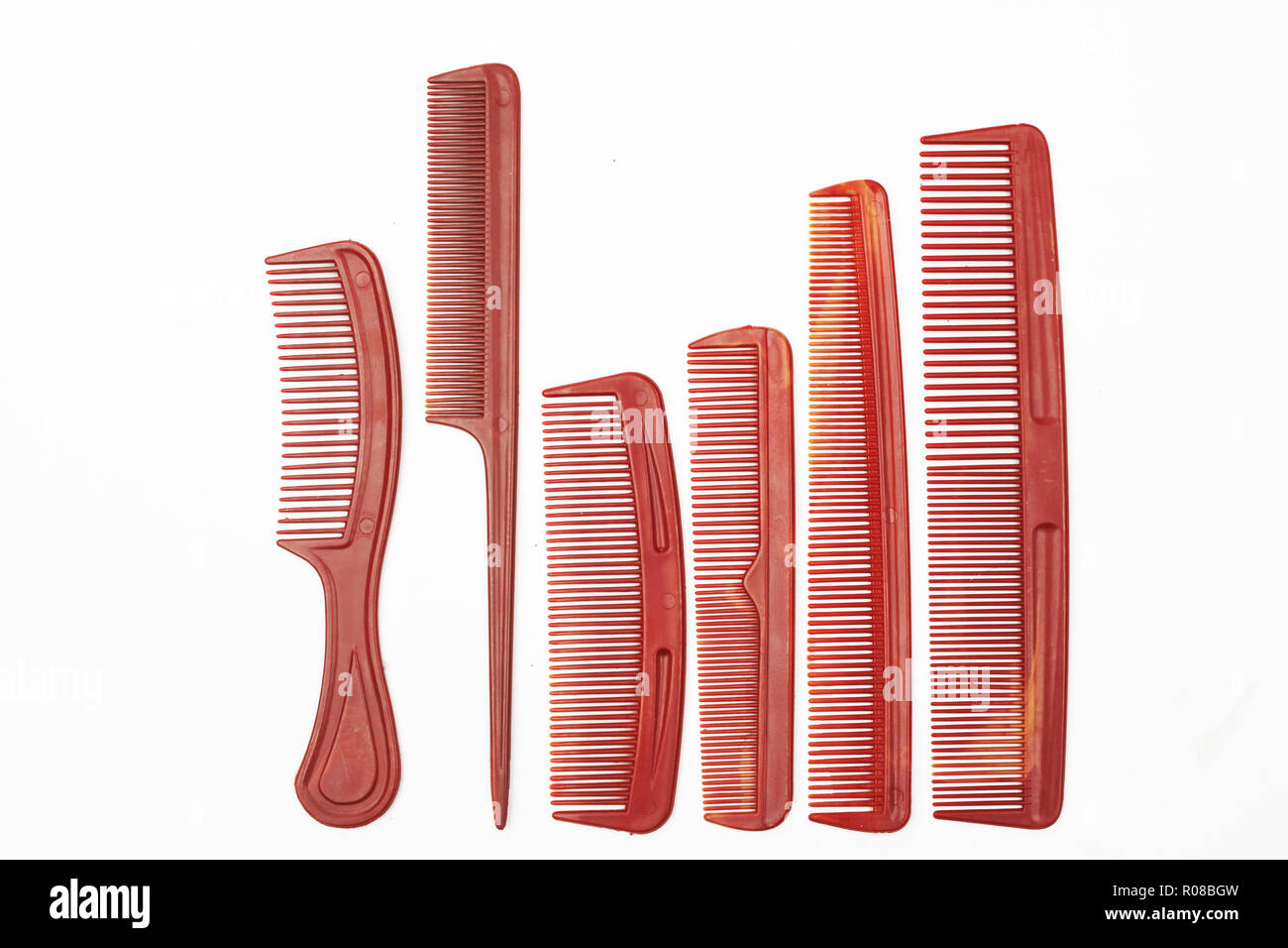 Assorted plastic combs on white background Stock Photo - Alamy