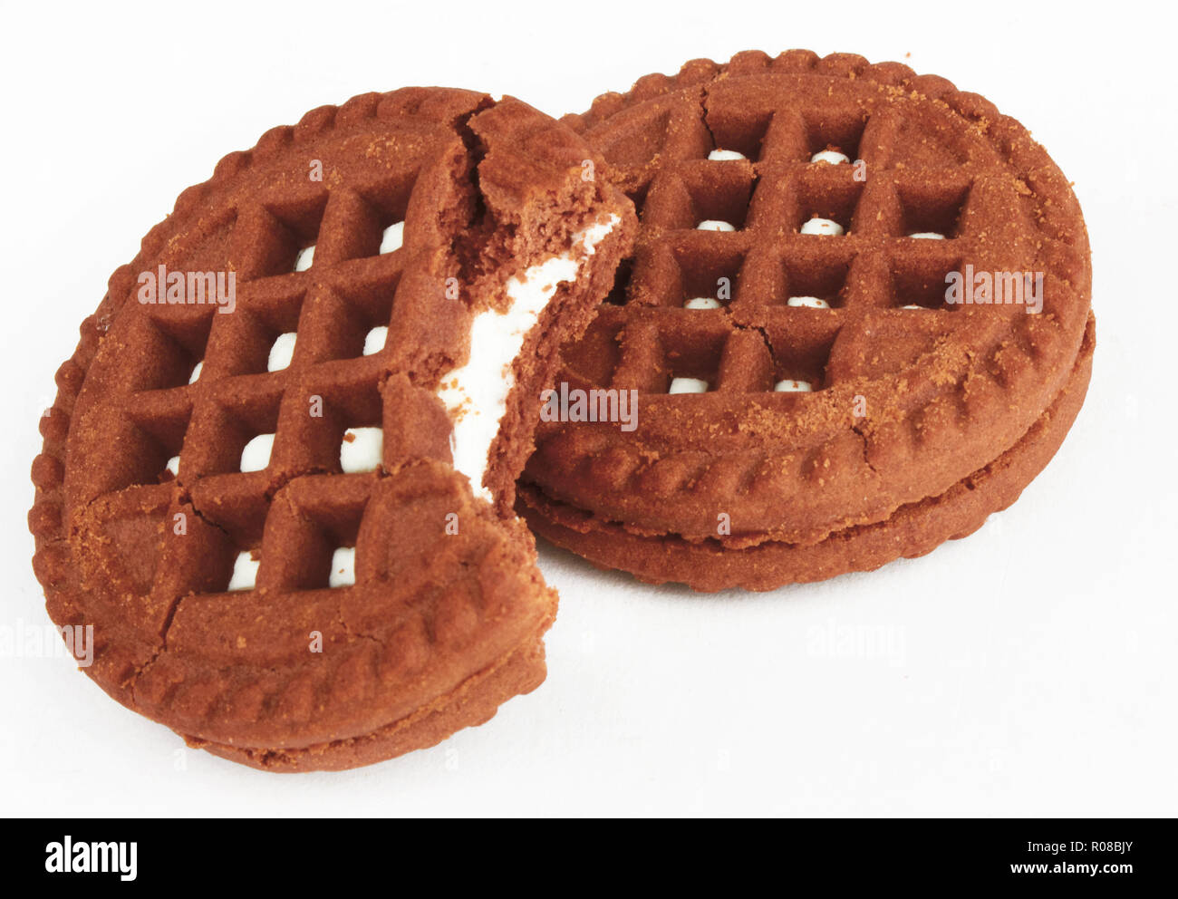 two chocolate cookies on white background Stock Photo - Alamy