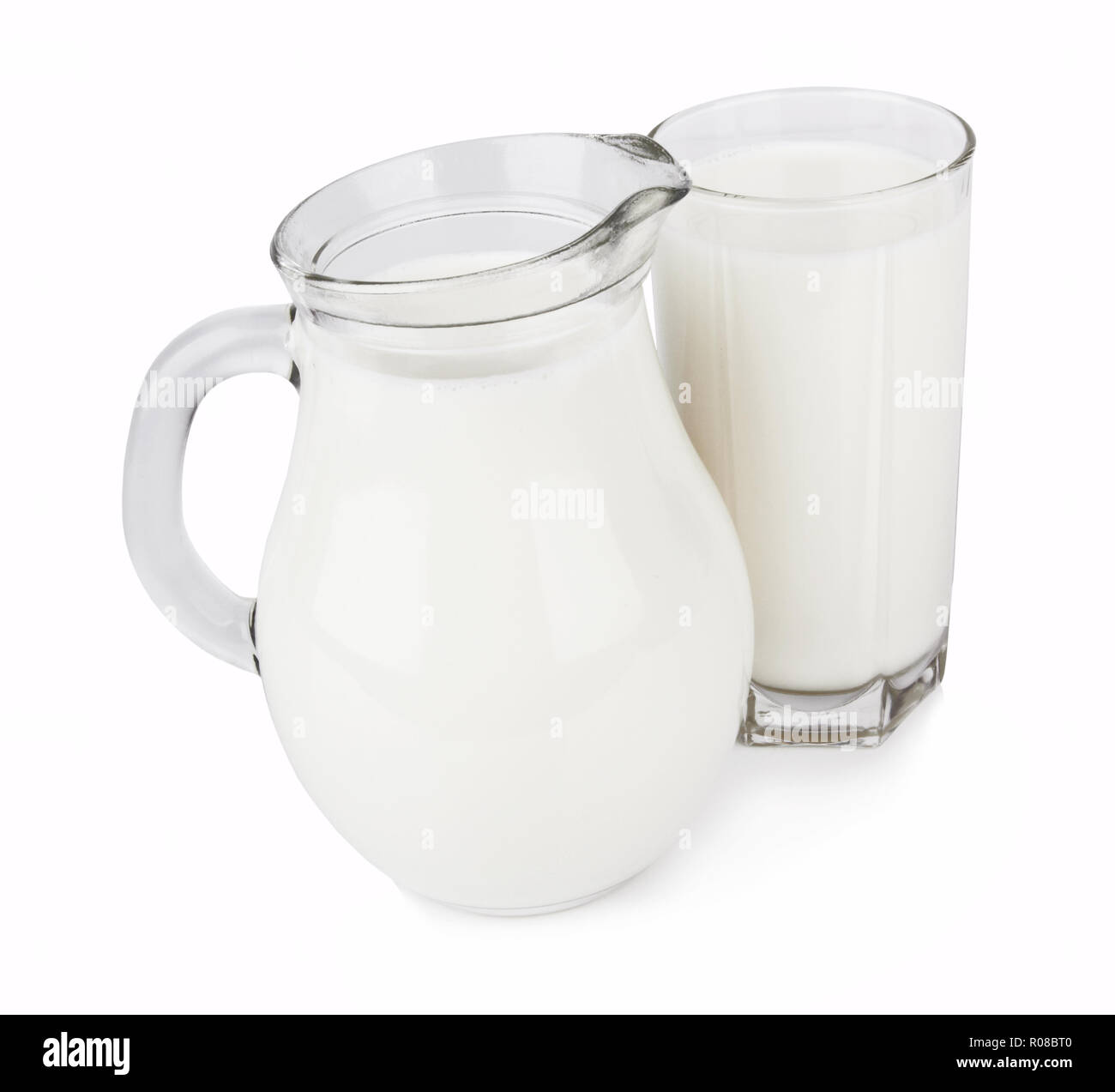 Pitcher and glass of milk on a white background Stock Photo - Alamy