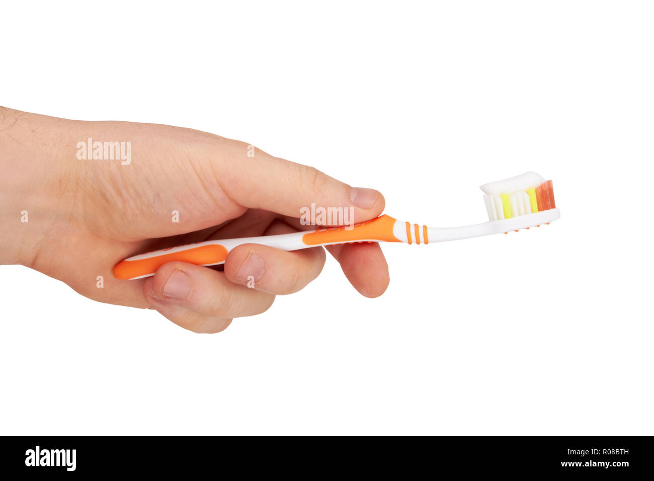 Hand holding toothbrush hi-res stock photography and images - Alamy