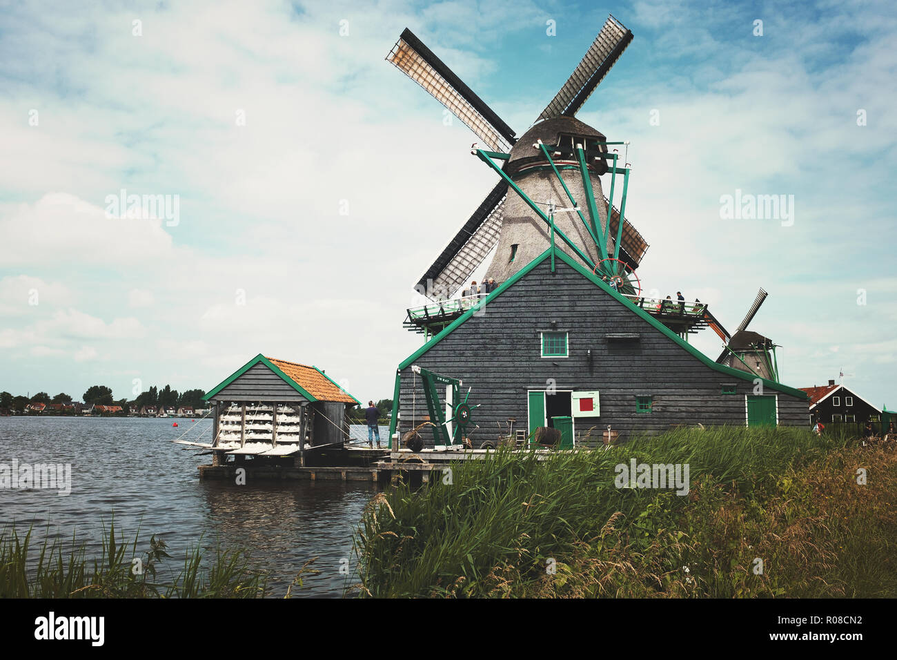 Historic windmills on the water in zaanse schans hi-res stock ...