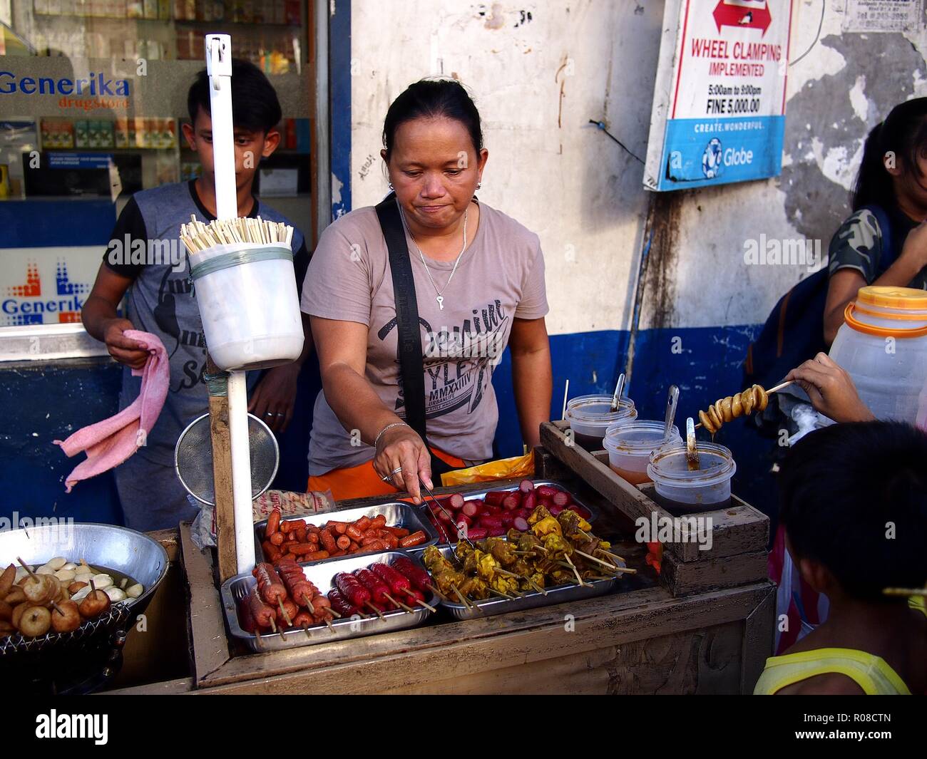 ANTIPOLO CITY, PHILIPPINES - OCTOBER 27, 2018: A street vendor sells ...