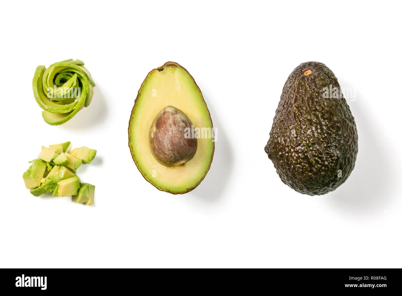 Slices of avocado on white background. Whole and half with leaves ...