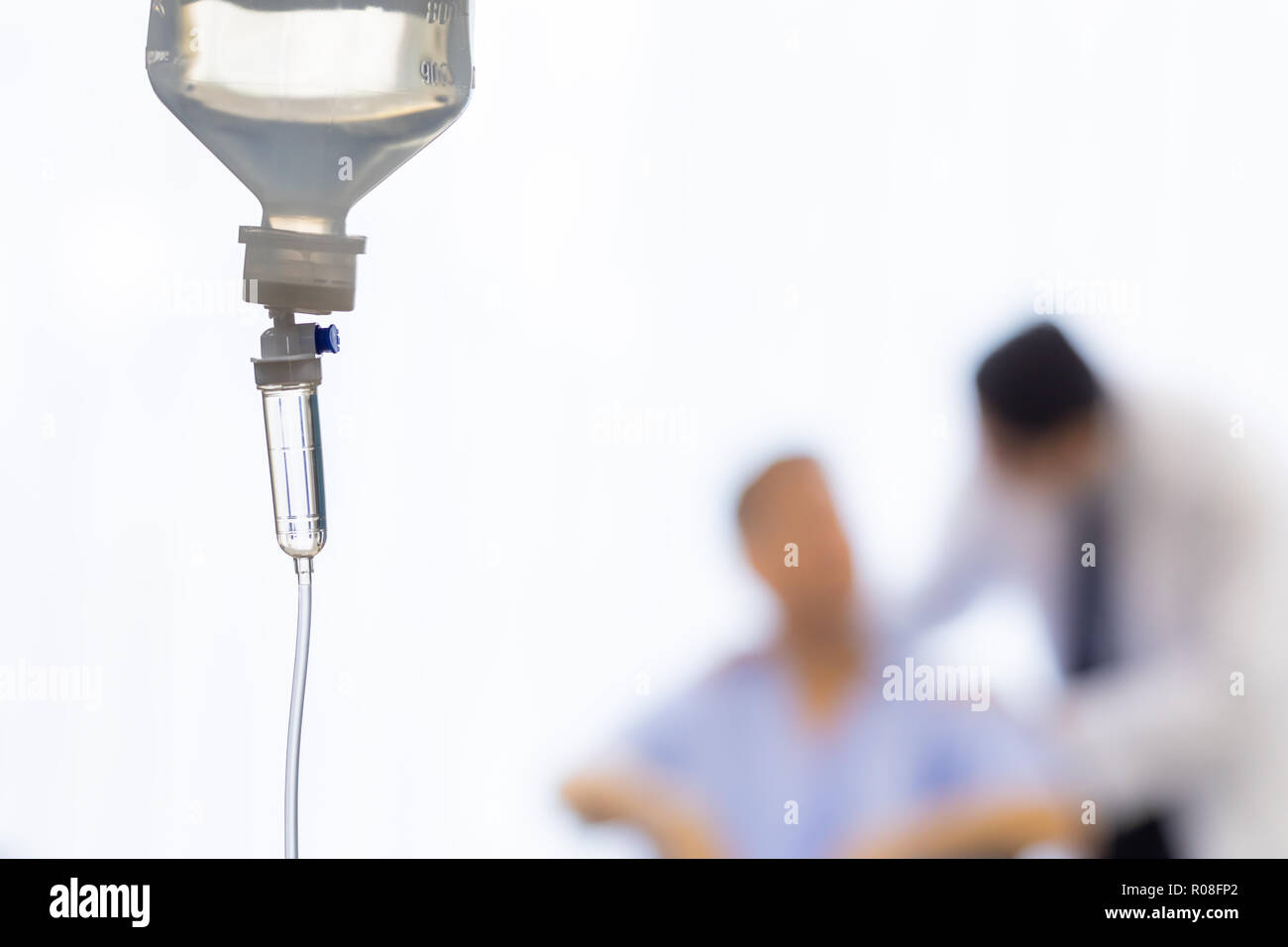 Set iv fluid intravenous drop saline drip in hospital room with patient ...