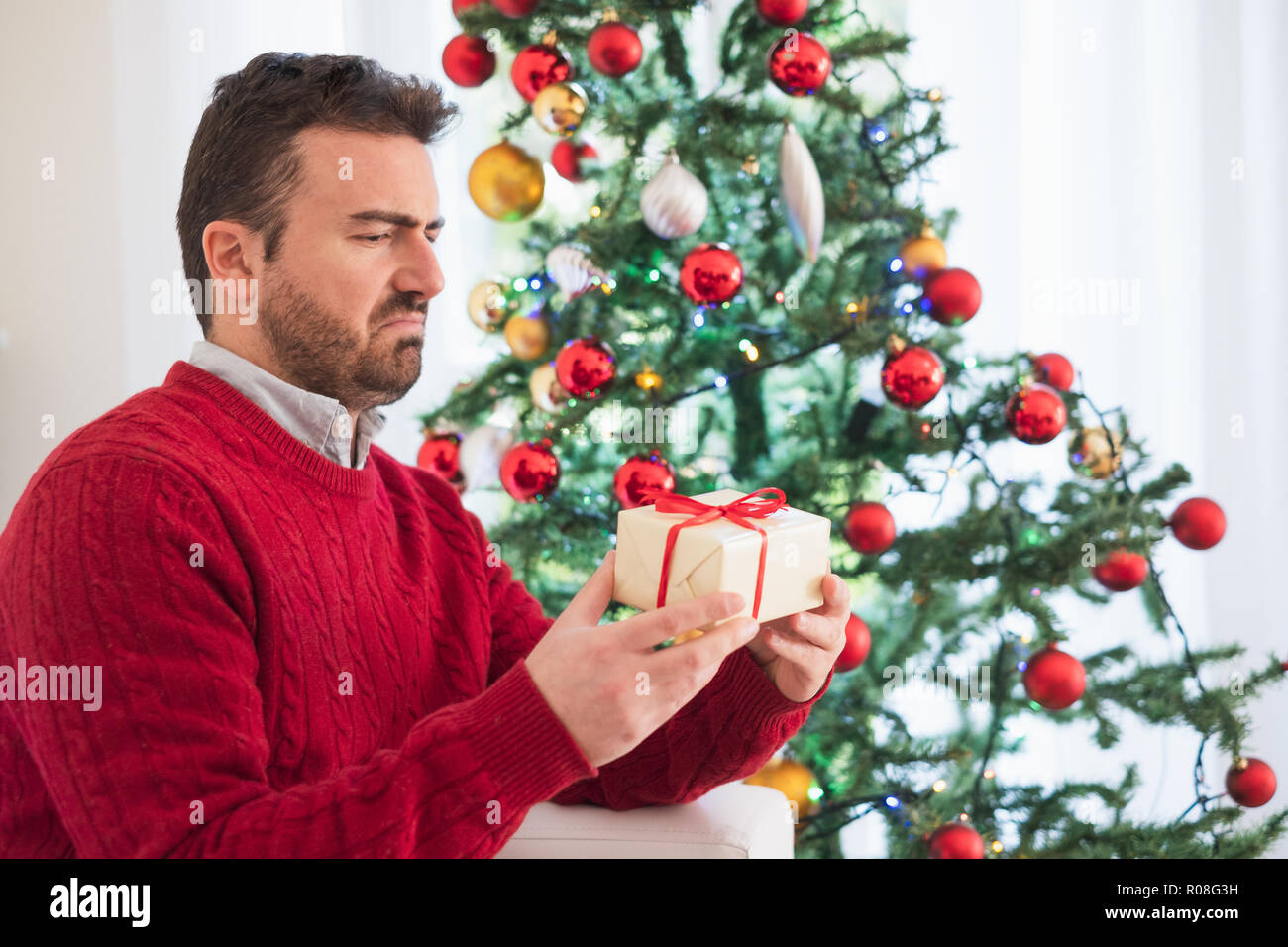 Surprised man present hi-res stock photography and images - Alamy