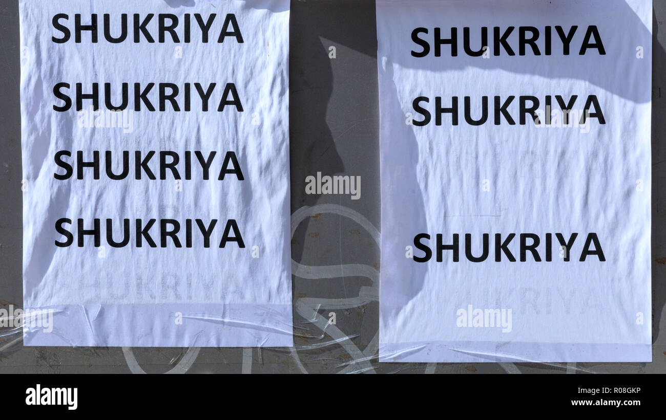 Shukriya, Arab for thankful (also shukria), printed posters on a wall ...