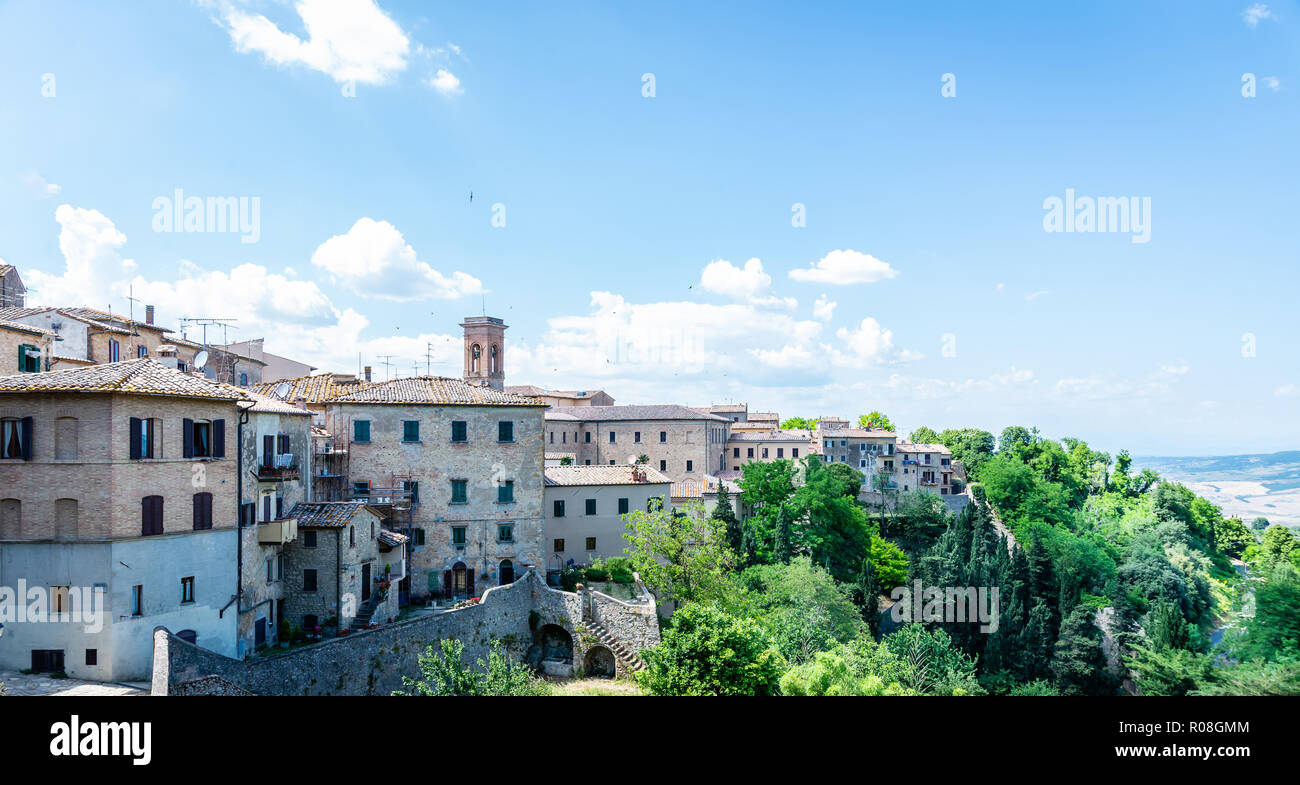 Horizontal photo with several buildings of Voltera town. The town is ...