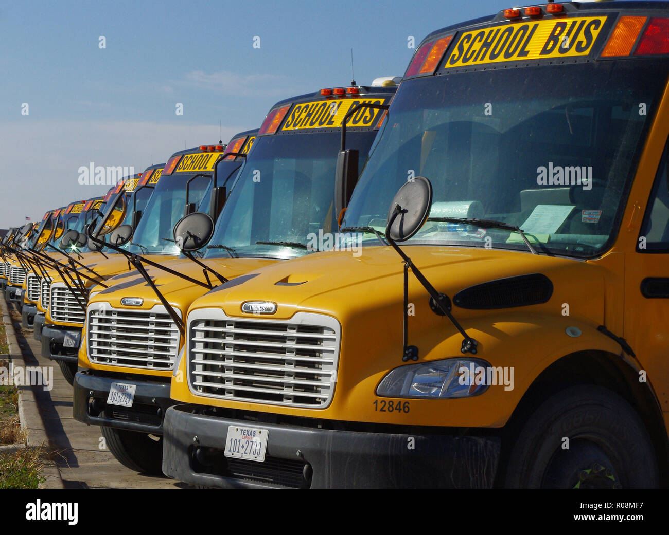 American School Buses parking lot Stock Photo - Alamy