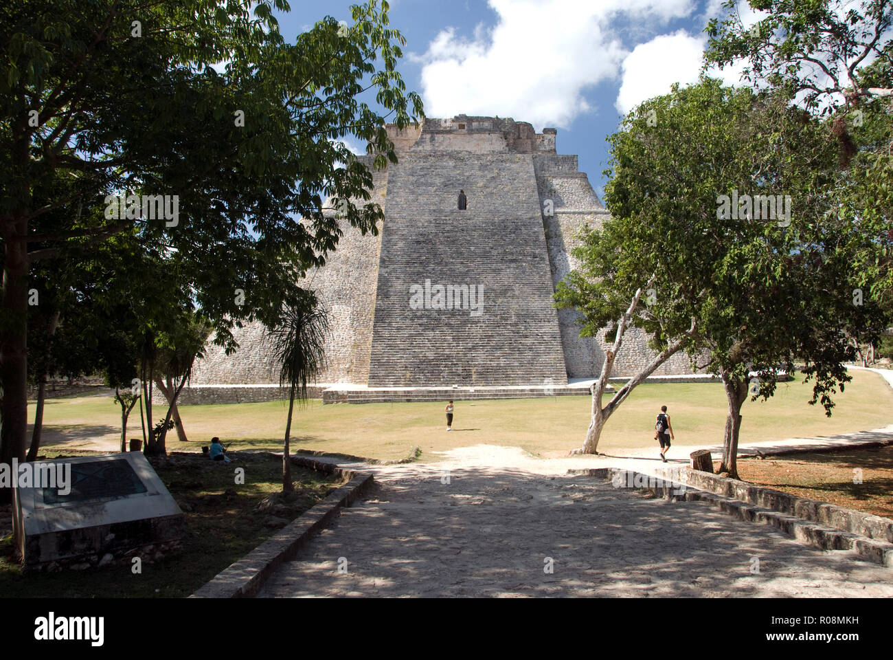 Tourists view the Pyramid of the Magician (Piramide del Adivino), a ...