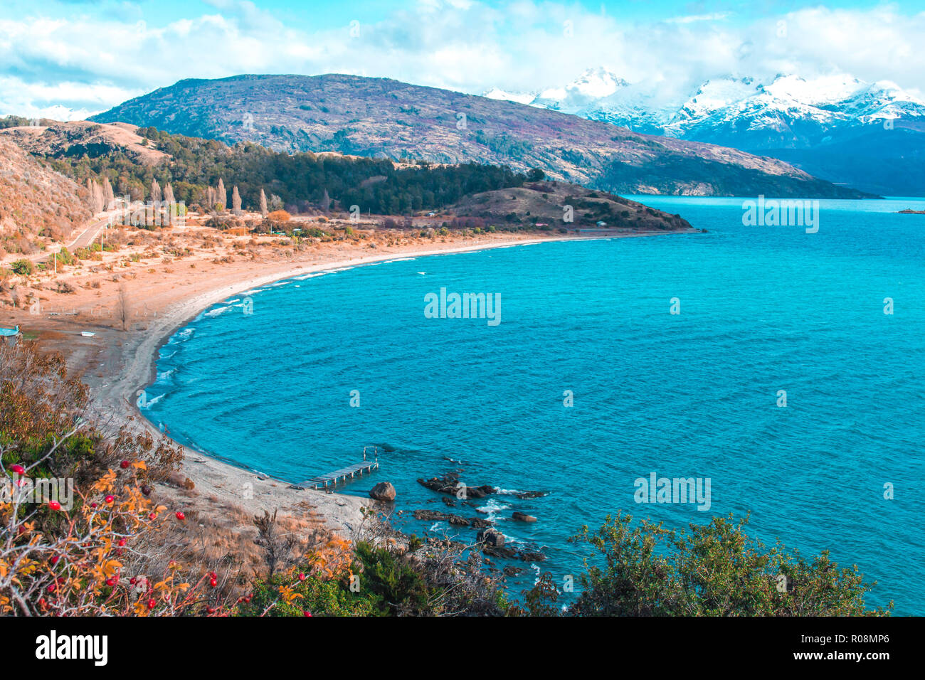 dirt road along the beautiful turquoise lake General Carrera at chilean ...