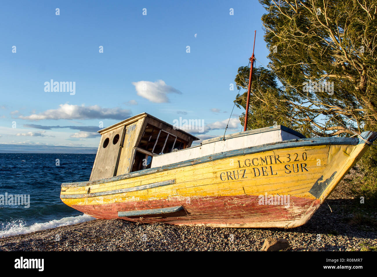 a fisherman's boat stranded at Chile Chilo beach of Playa Grande, the ...