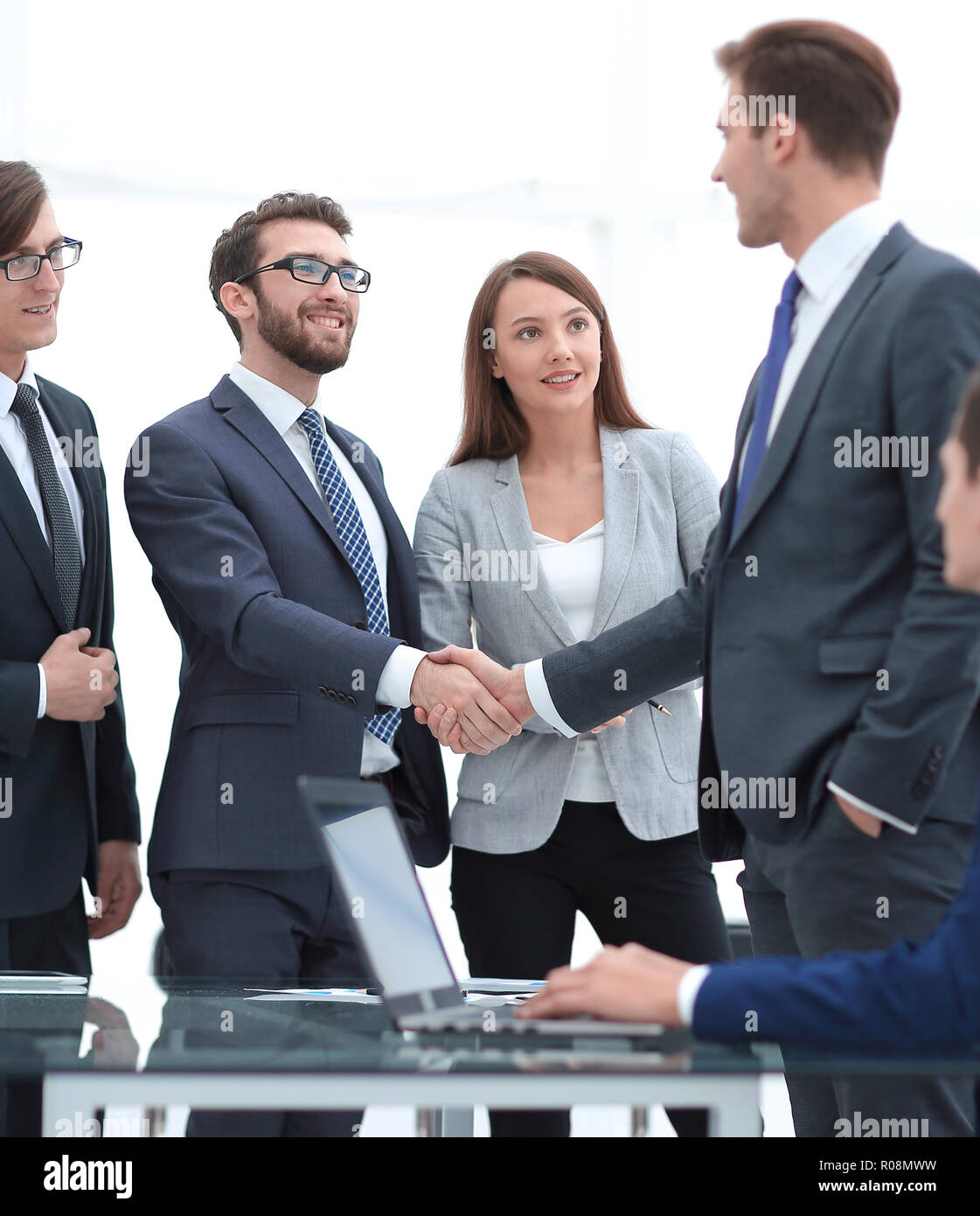 handshake business partners after signing a contract Stock Photo - Alamy