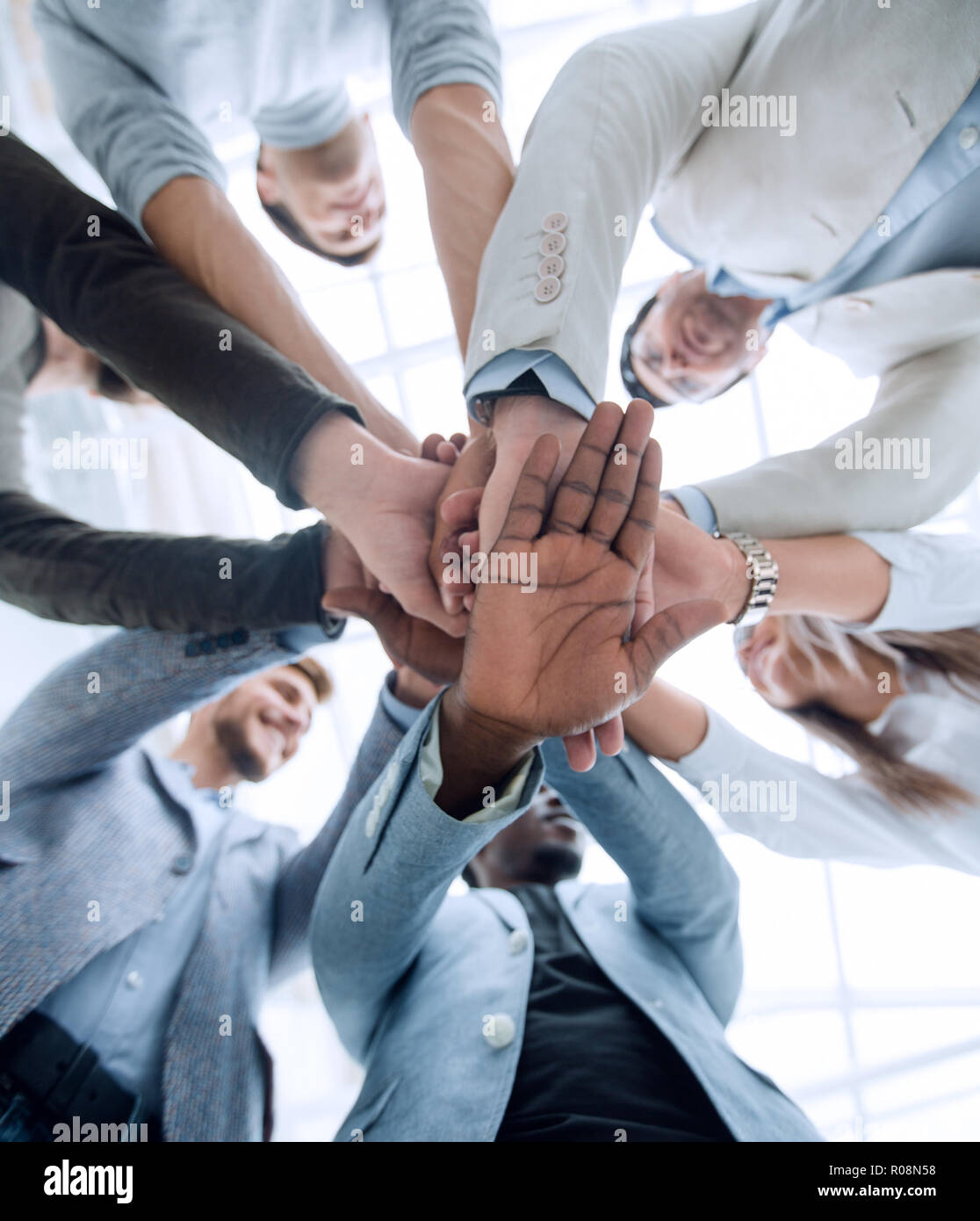 business background.business team making a stack of hands. the concept ...