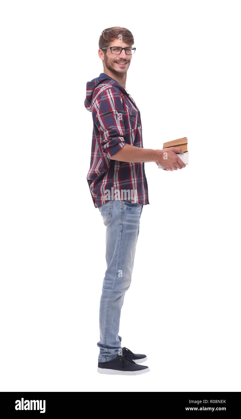 side view. smiling male student with books.isolated on white background ...