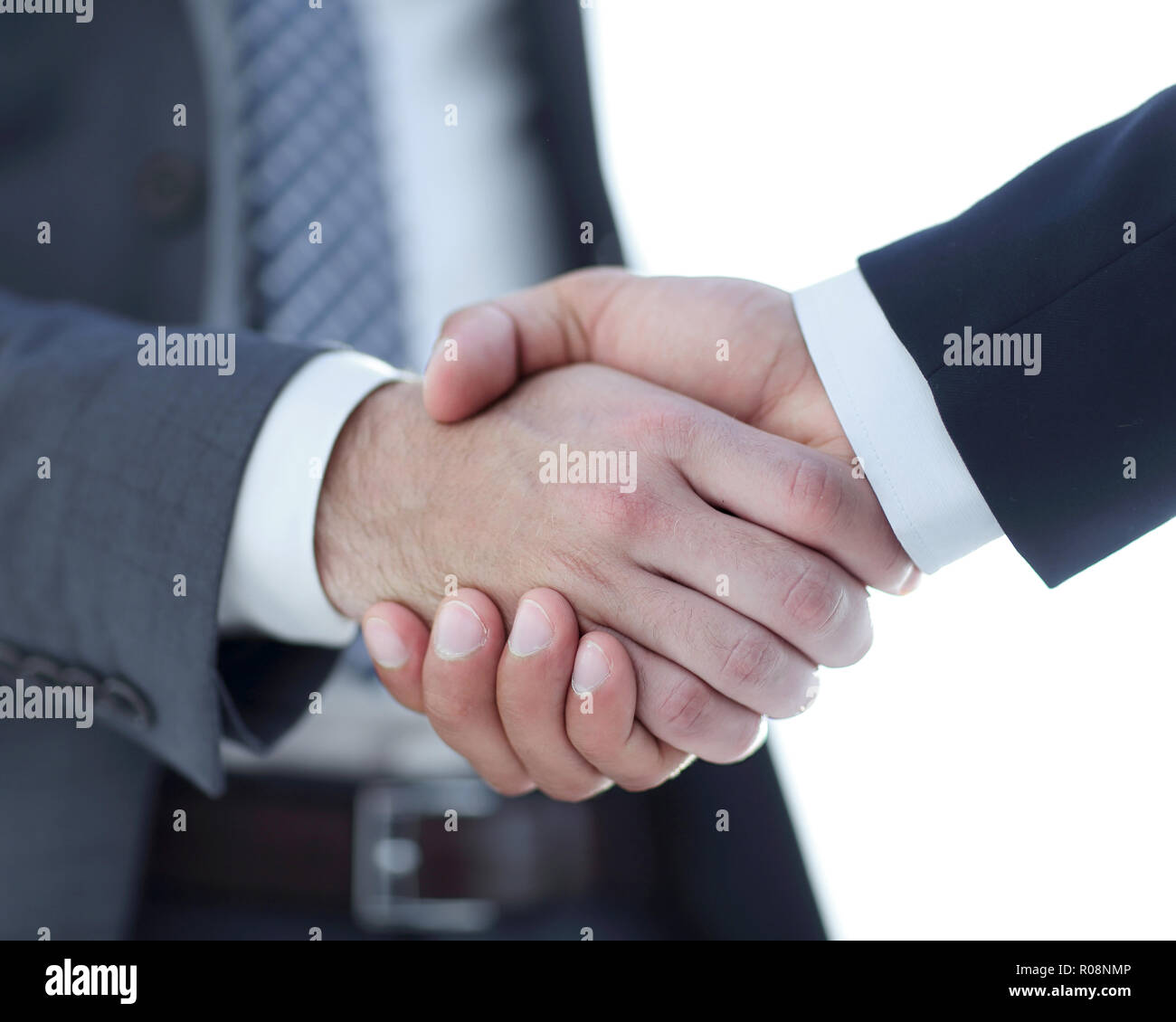 Photo of handshake of two cheerful businessmen Stock Photo - Alamy