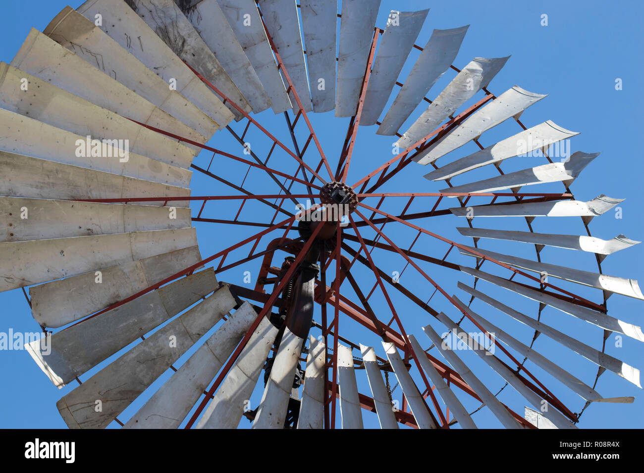 Large outback windmill with blue sky background in Western Queensland ...