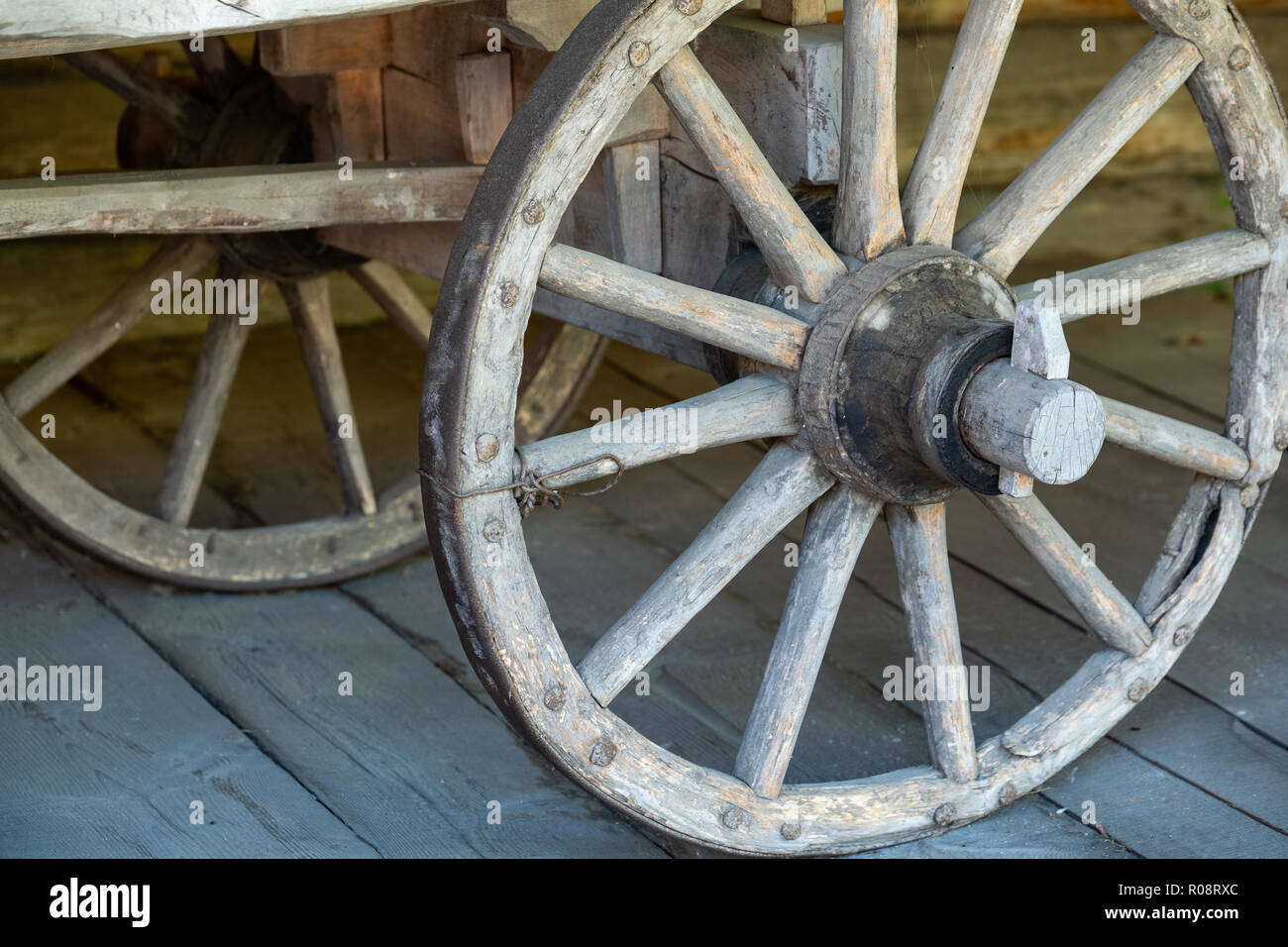 A photo of an old wooden cartwheel Stock Photo - Alamy