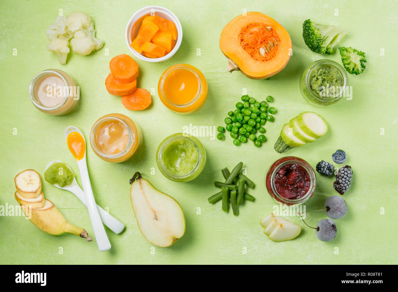 Colorful baby food purees in glass jars with ingredients. Healthy ...